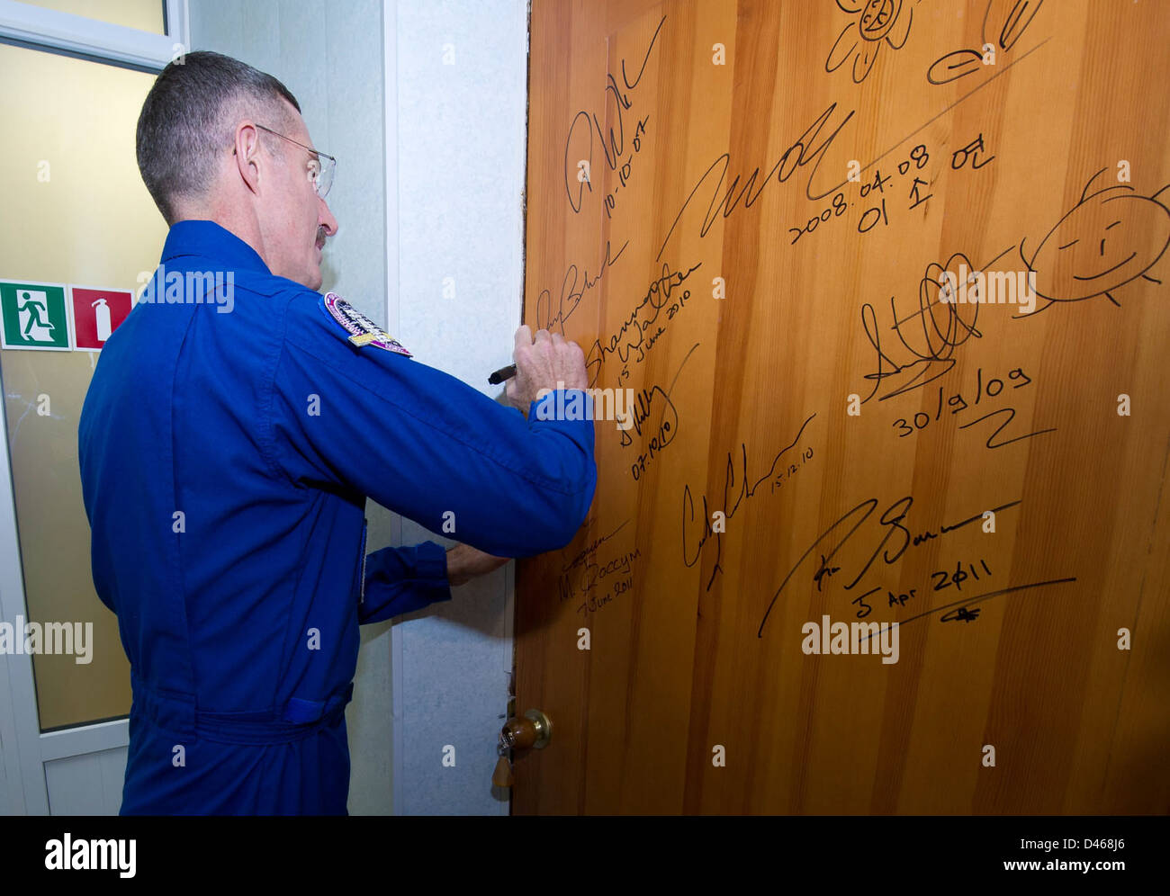 Expedition 29 crew members, including astronaut Daniel Burbank, prepare ...