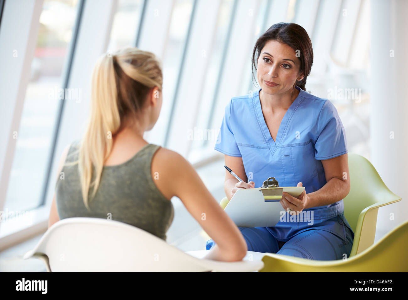Nurse Meeting With Teenage Girl In Modern Hospital Stock Photo - Alamy