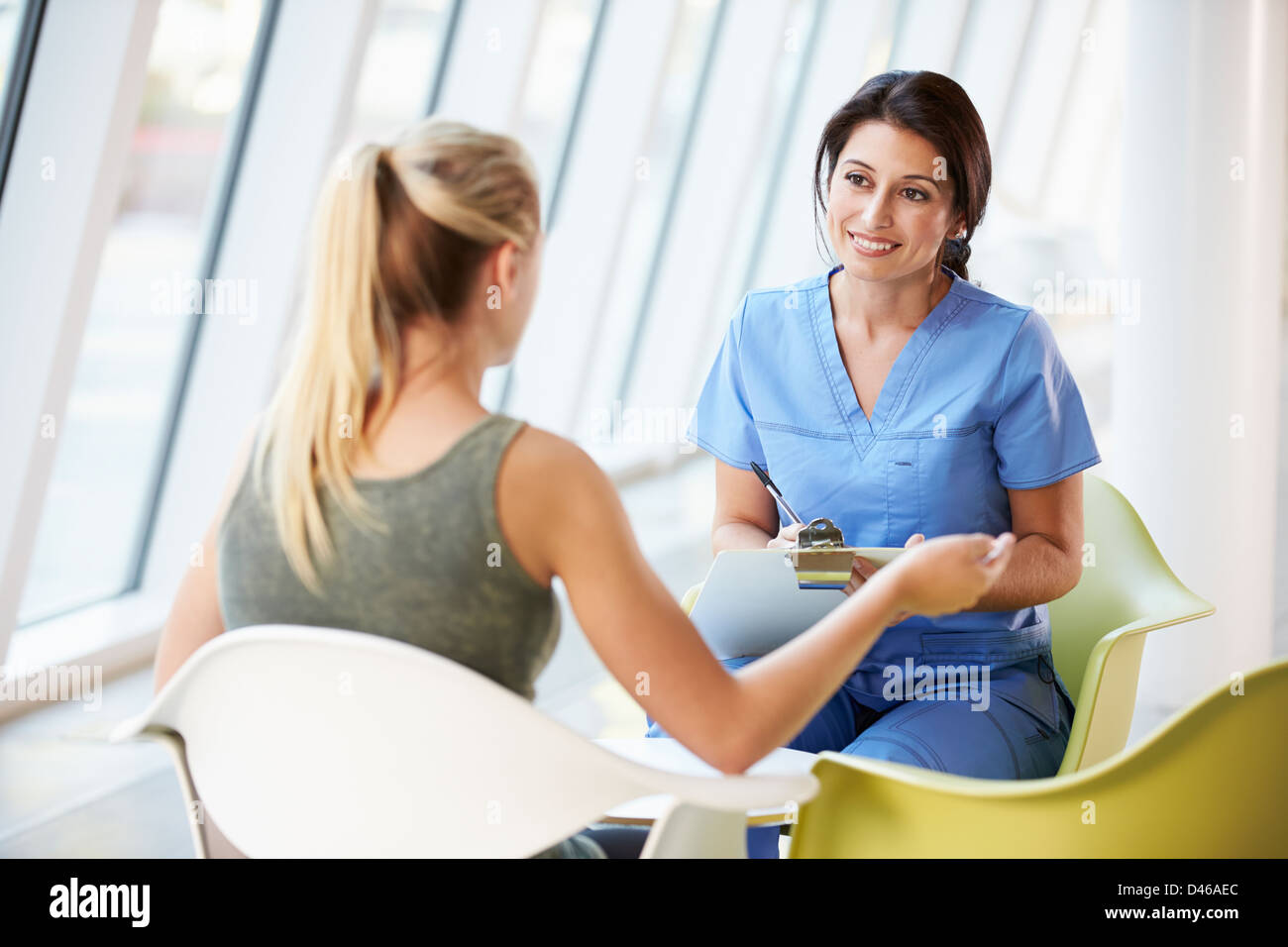 Nurse Meeting With Teenage Girl In Modern Hospital Stock Photo - Alamy