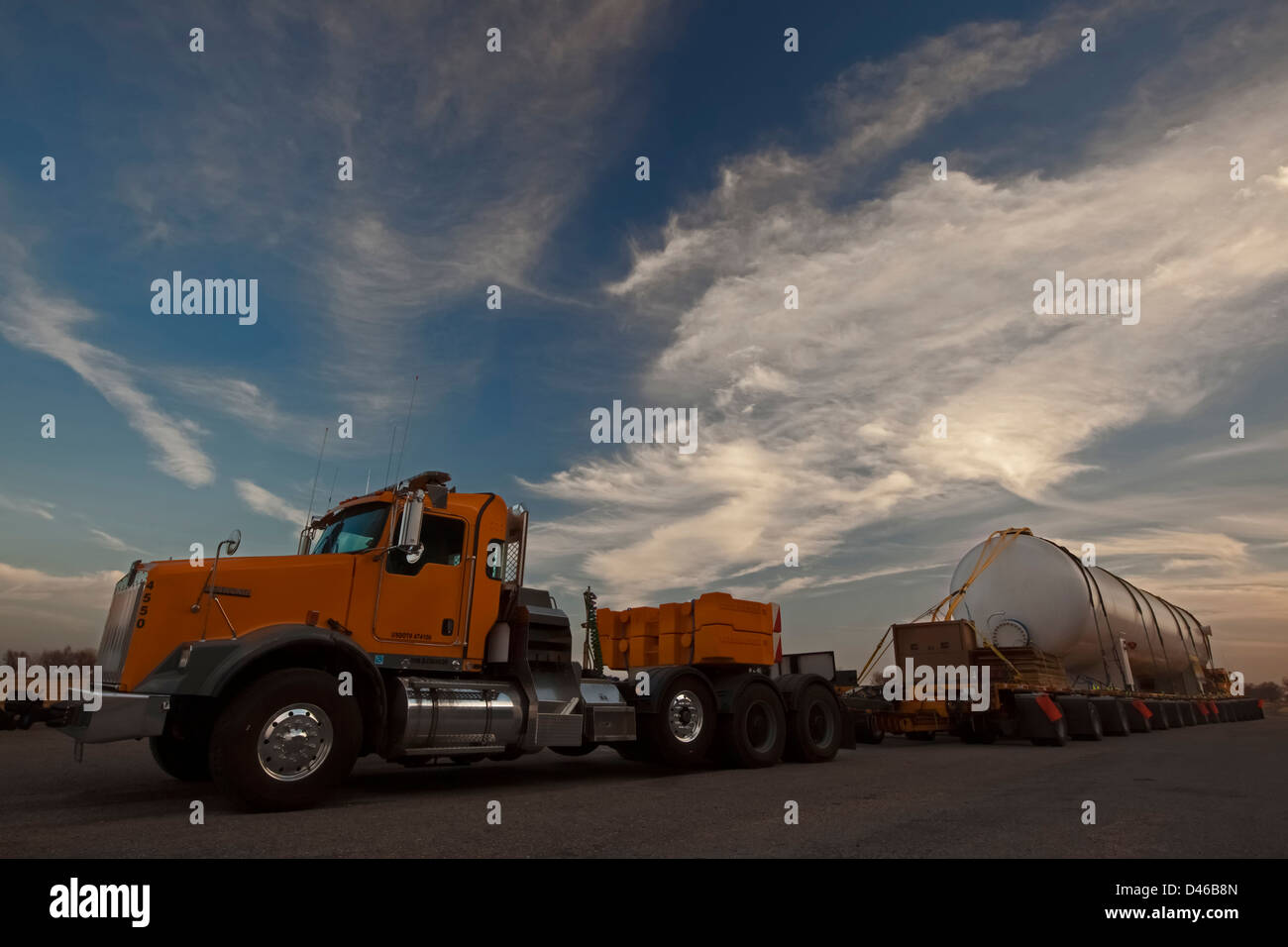 Oversize transportation trucks hauling oil equipment on the road Stock ...
