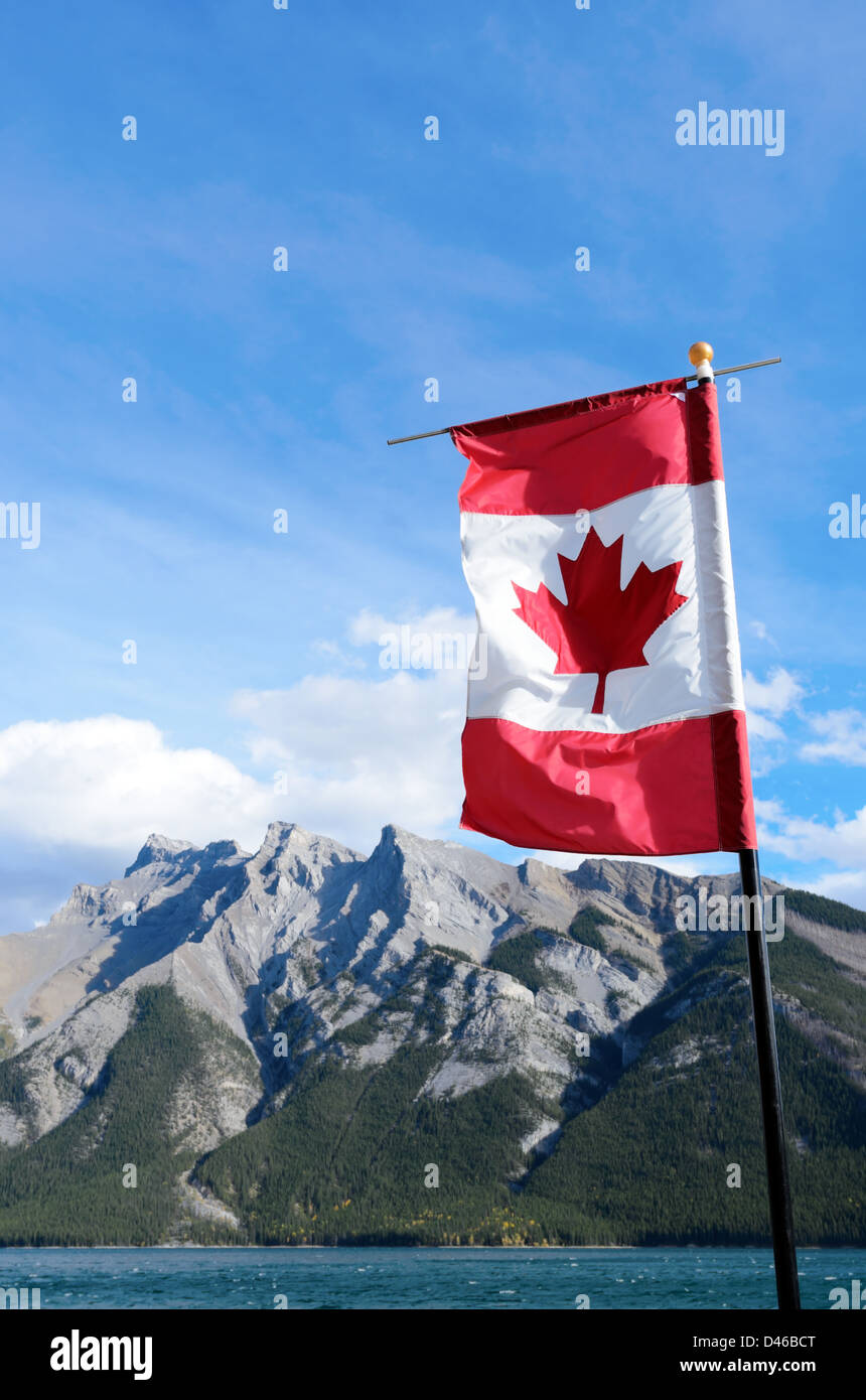 Canadian flag in front of Mount Inglismaldie at Lake Minnewanka Banff ...