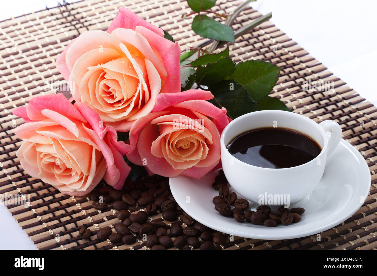 Flowers, cup of coffee and rose Close up on the fabric background Stock ...