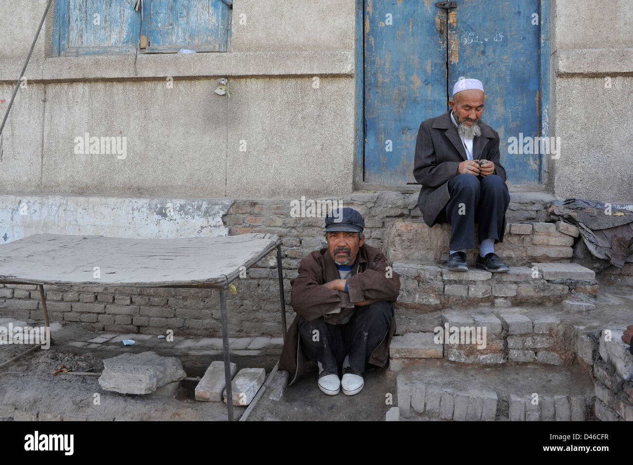 sitting on the door steps Stock Photo - Alamy