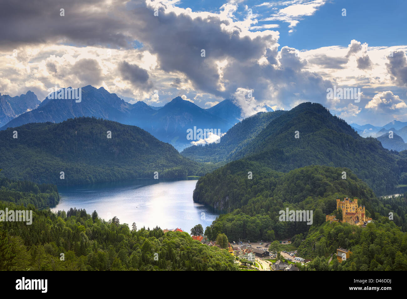 Aerial view on medieval castle on the hill near alpine lake among ...