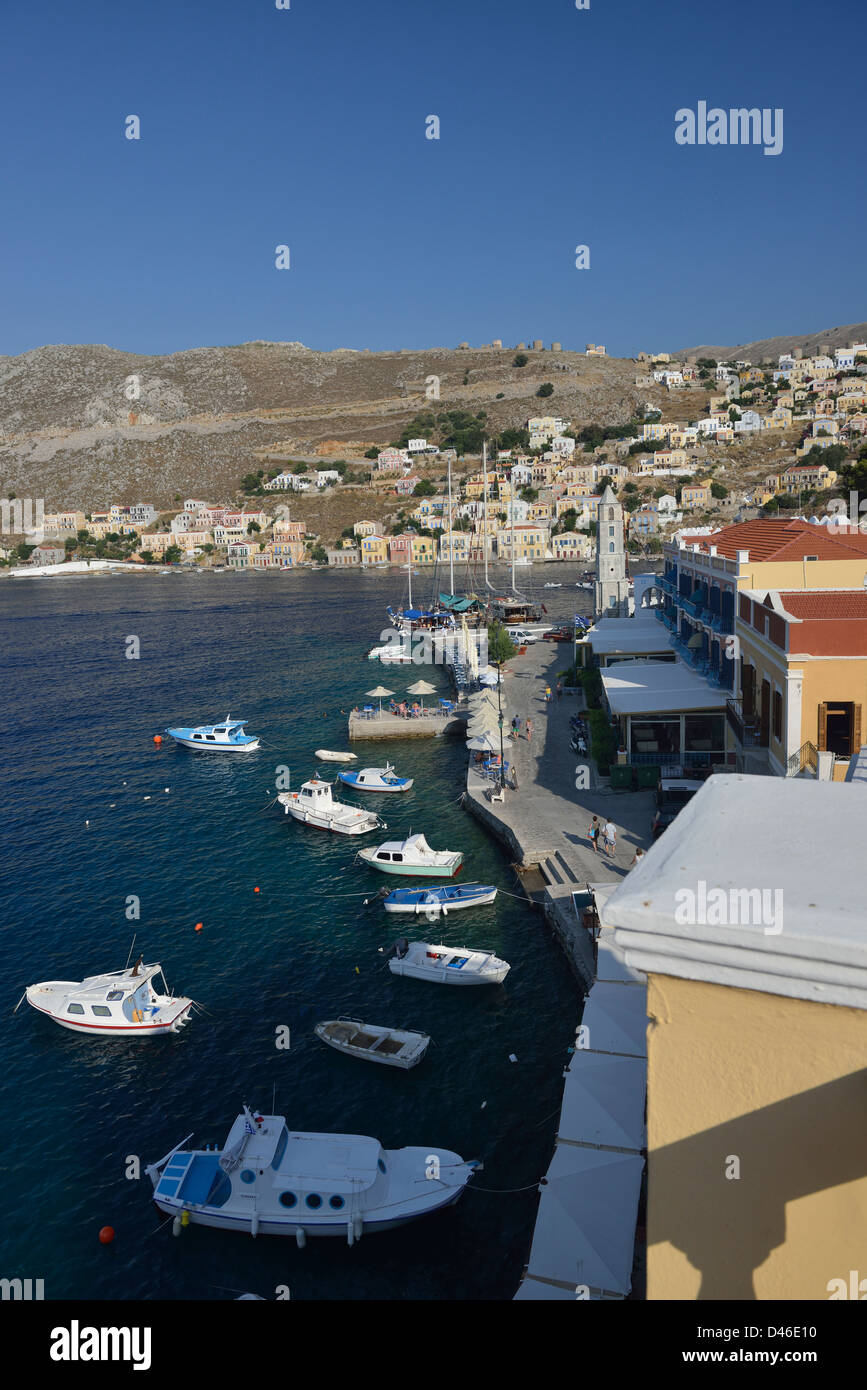 Boats crowd the Harani quay of the port of Yialos; Symi, Dodecanese ...