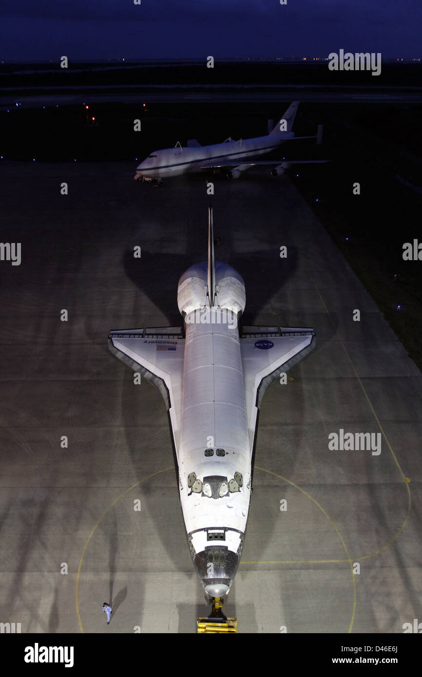 The space shuttle Discovery is prepared for mating to the Mate-Demate ...