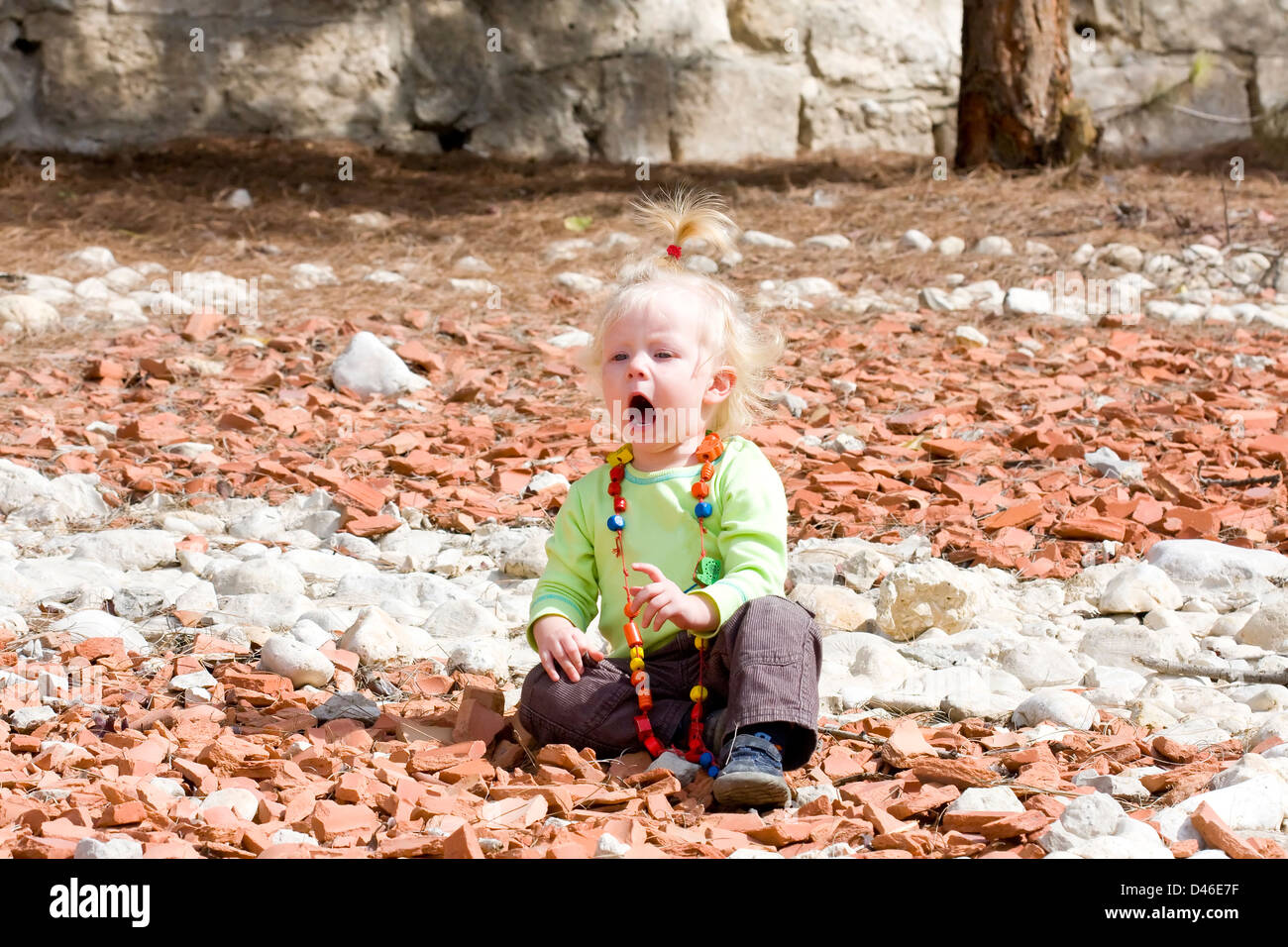 Blond toddler girl crying during the walk Stock Photo - Alamy