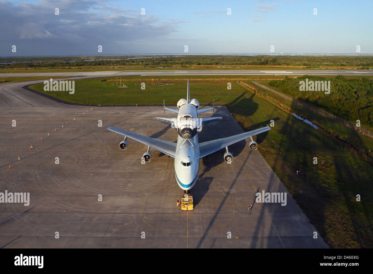 The Space Shuttle Discovery is seen atop the 747 Shuttle Carrier ...