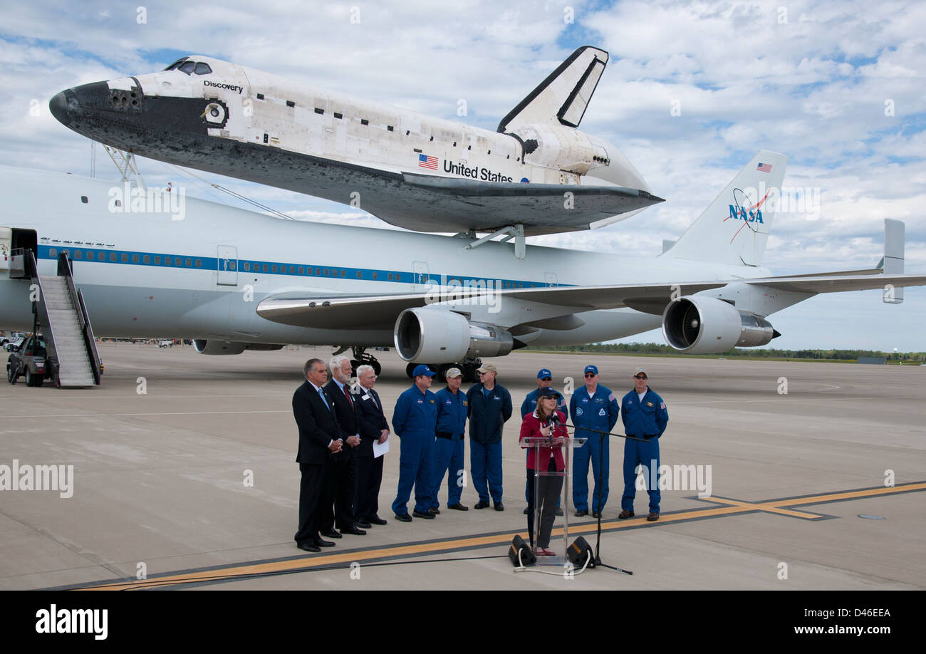 Space Shuttle Discovery lands at Washington Dulles International Airport, transported by the ...