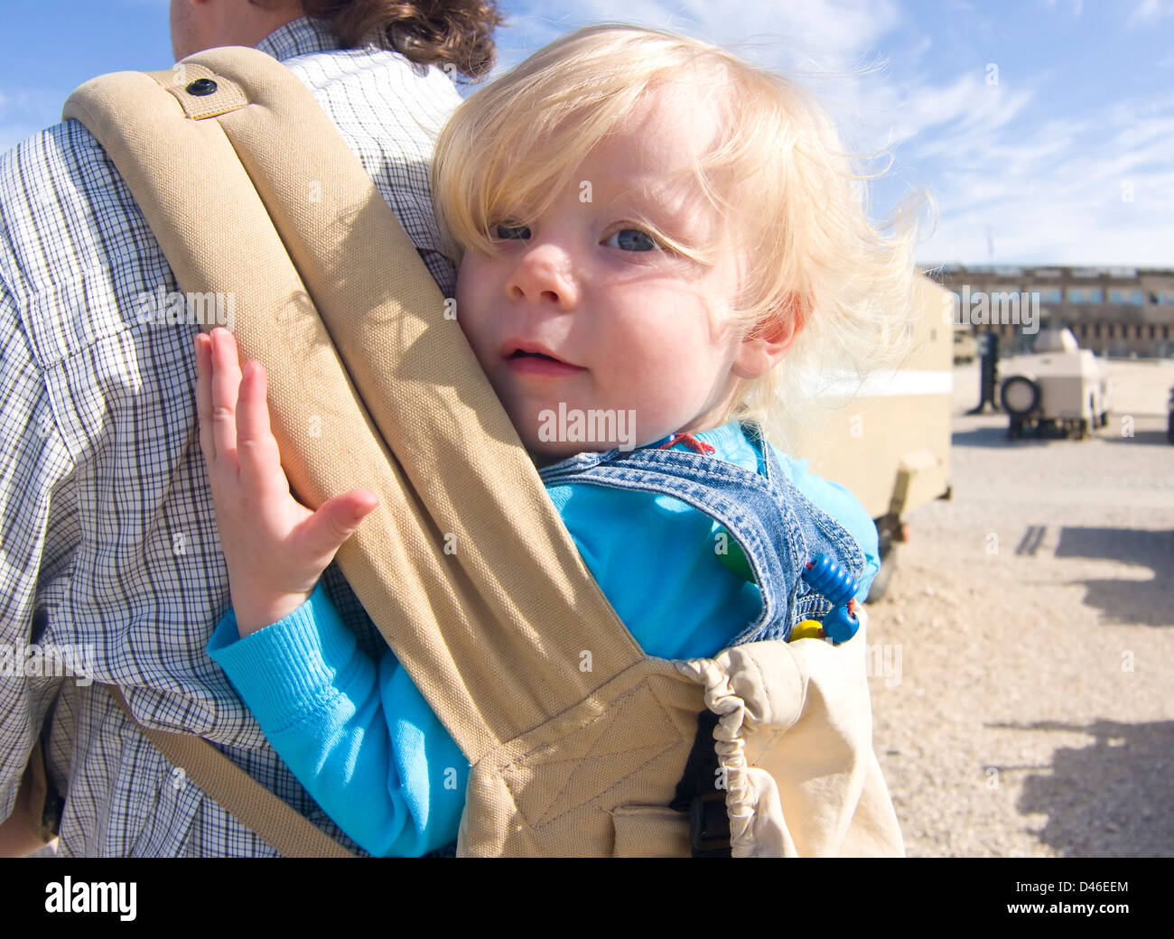 Woman carrying child back sling hi-res stock photography and images - Alamy