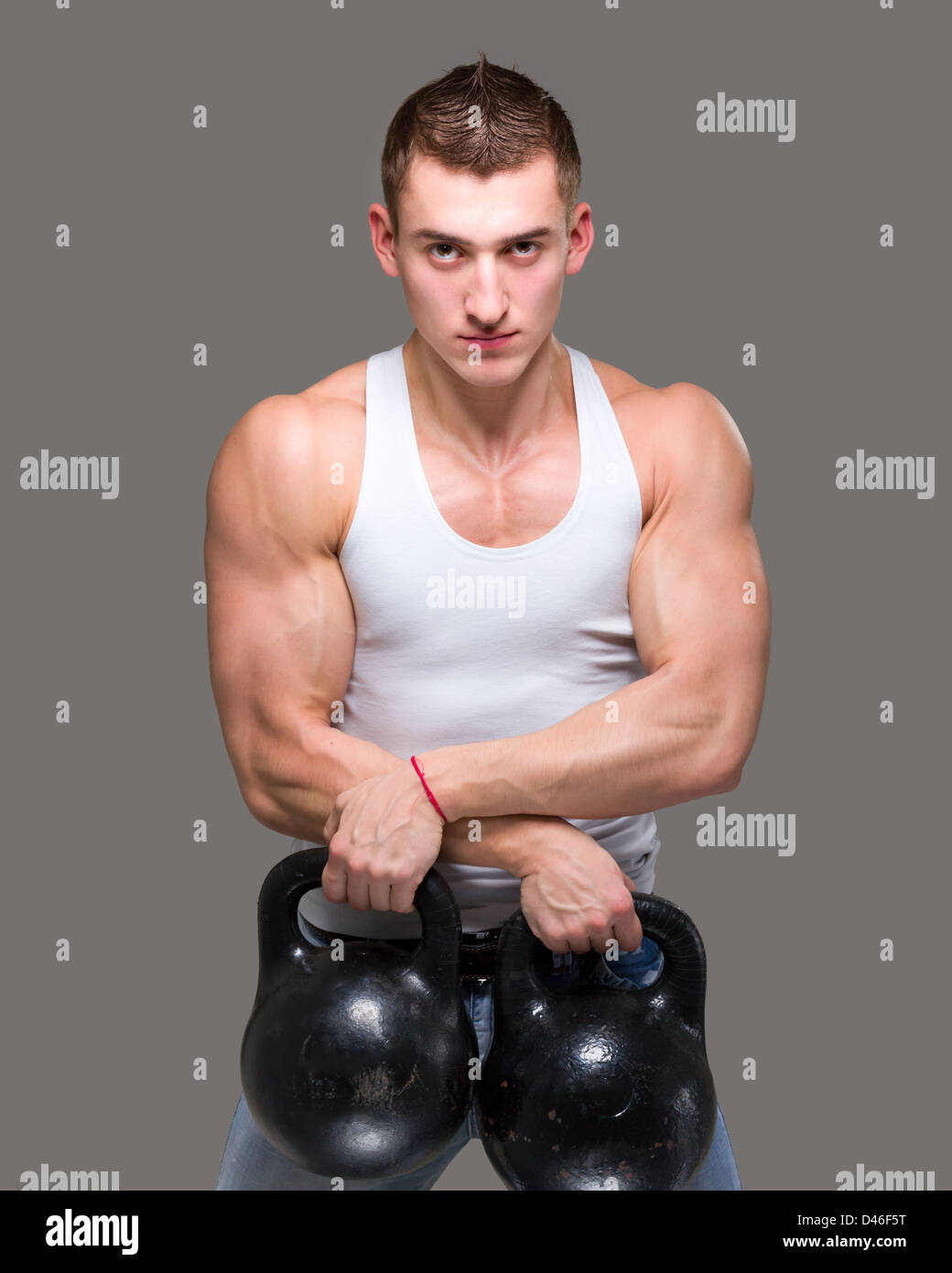 man exercising weight training workout fitness Stock Photo - Alamy