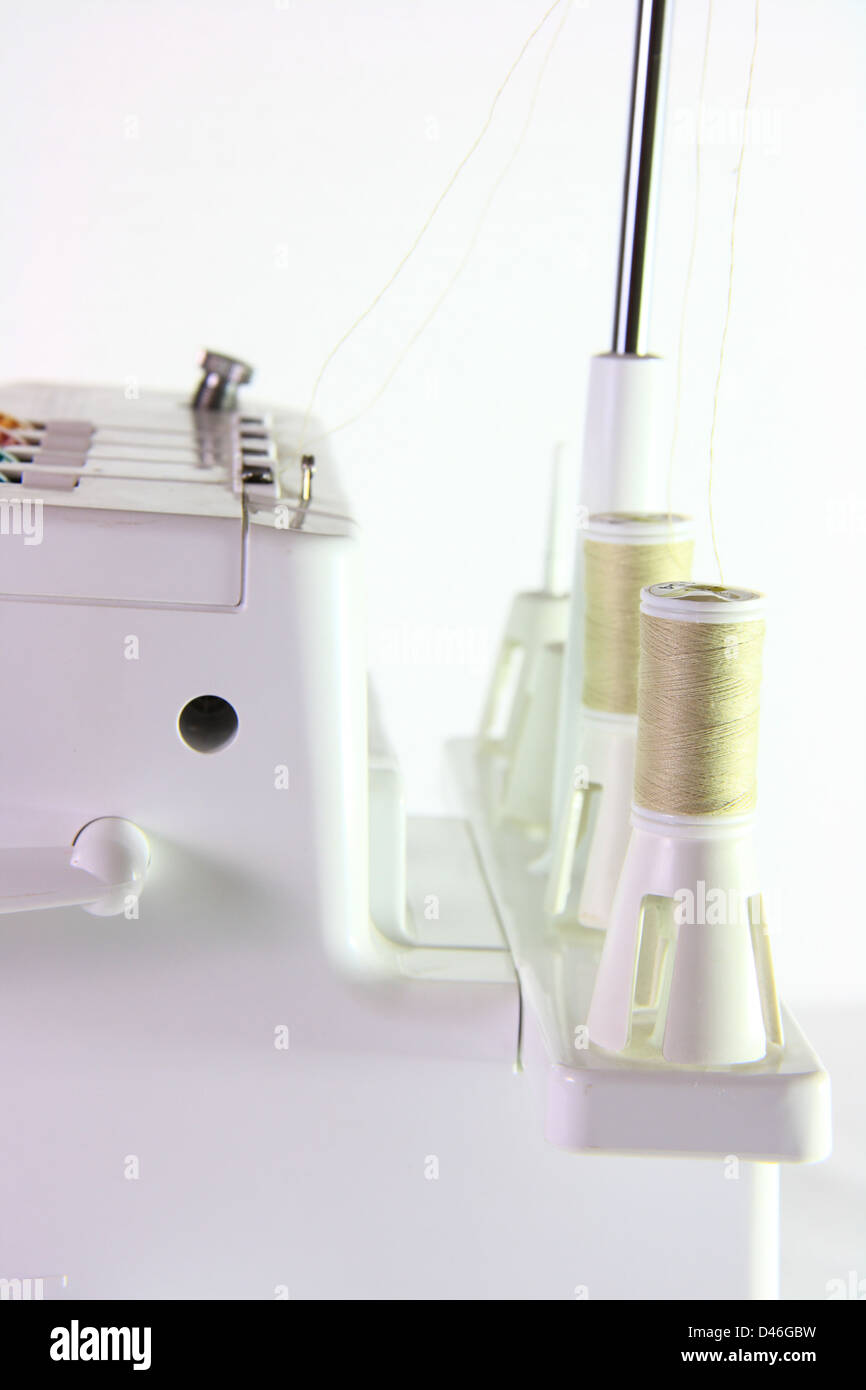 side of sewing machine on white background Stock Photo - Alamy