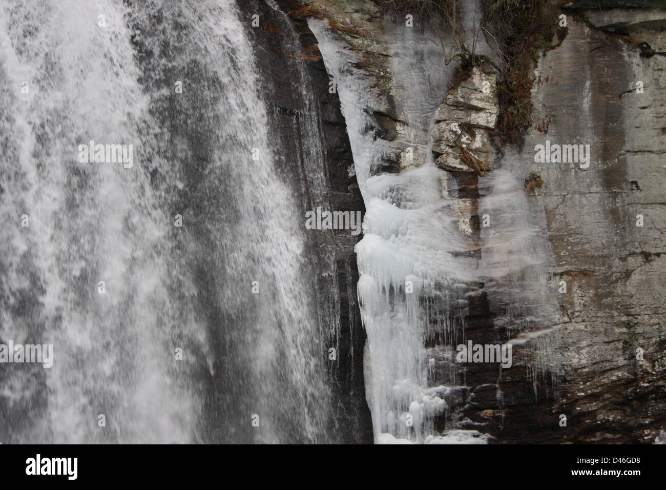 Winter abstract of a flowing waterfall and ice formed on rocks Stock ...