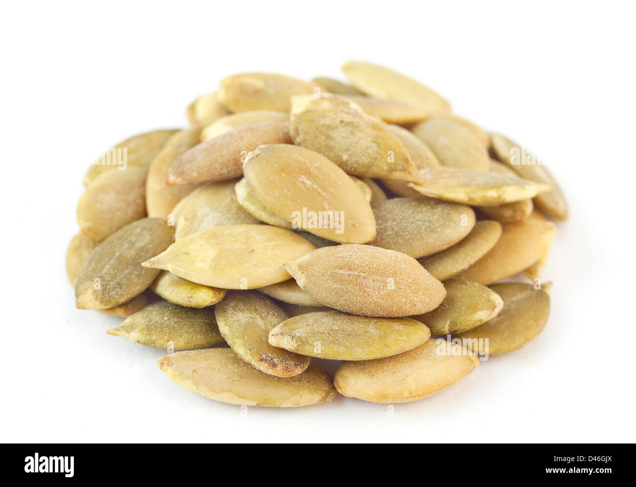 Pumpkin salted seeds on white Stock Photo - Alamy