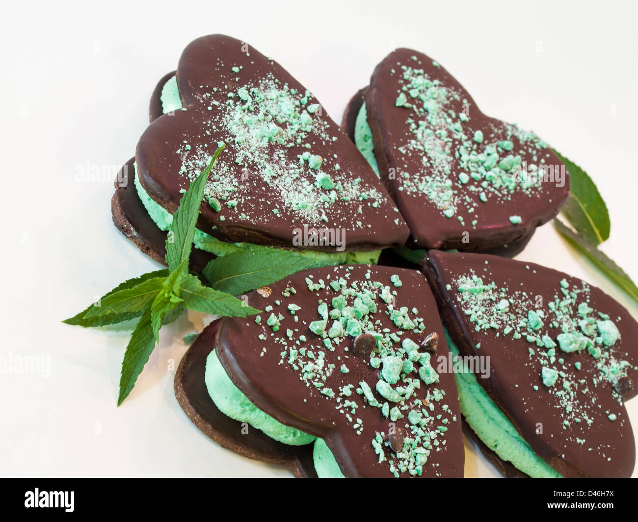Chocolate cookies with mint filling on white background Stock Photo - Alamy