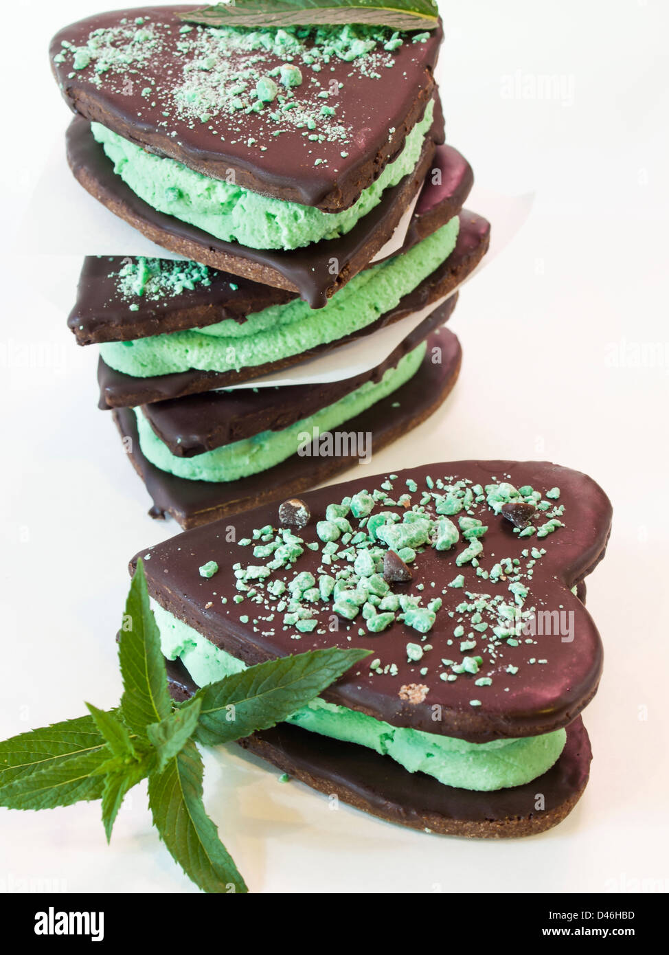 Chocolate cookies with mint filling on white background Stock Photo - Alamy