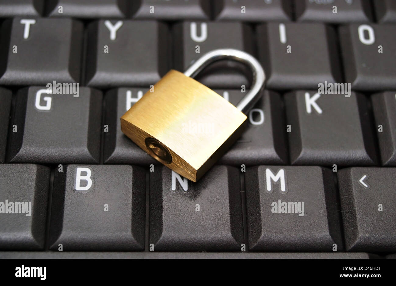 Padlock on laptop keyboard Stock Photo - Alamy