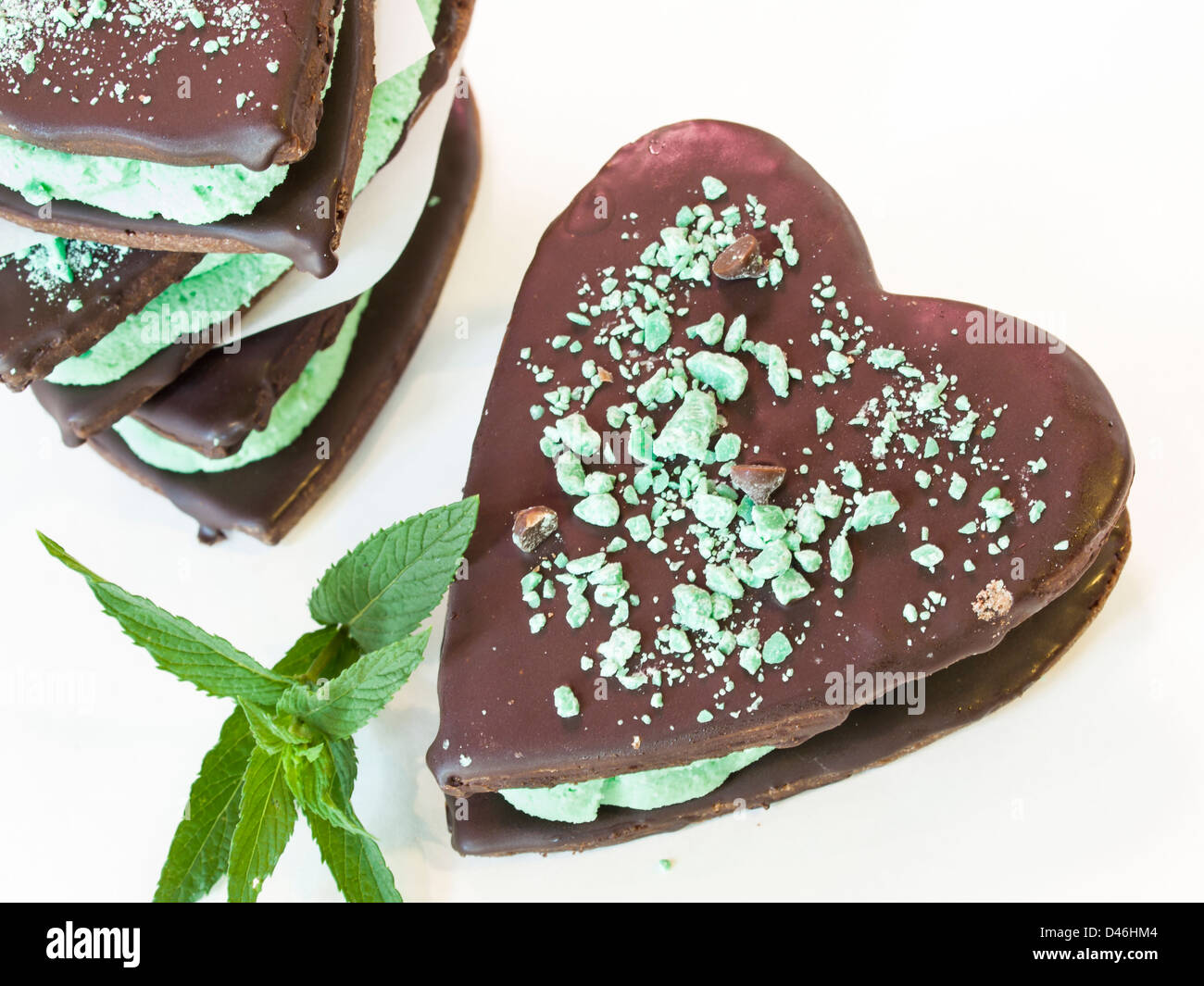 Chocolate cookies with mint filling on white background Stock Photo - Alamy