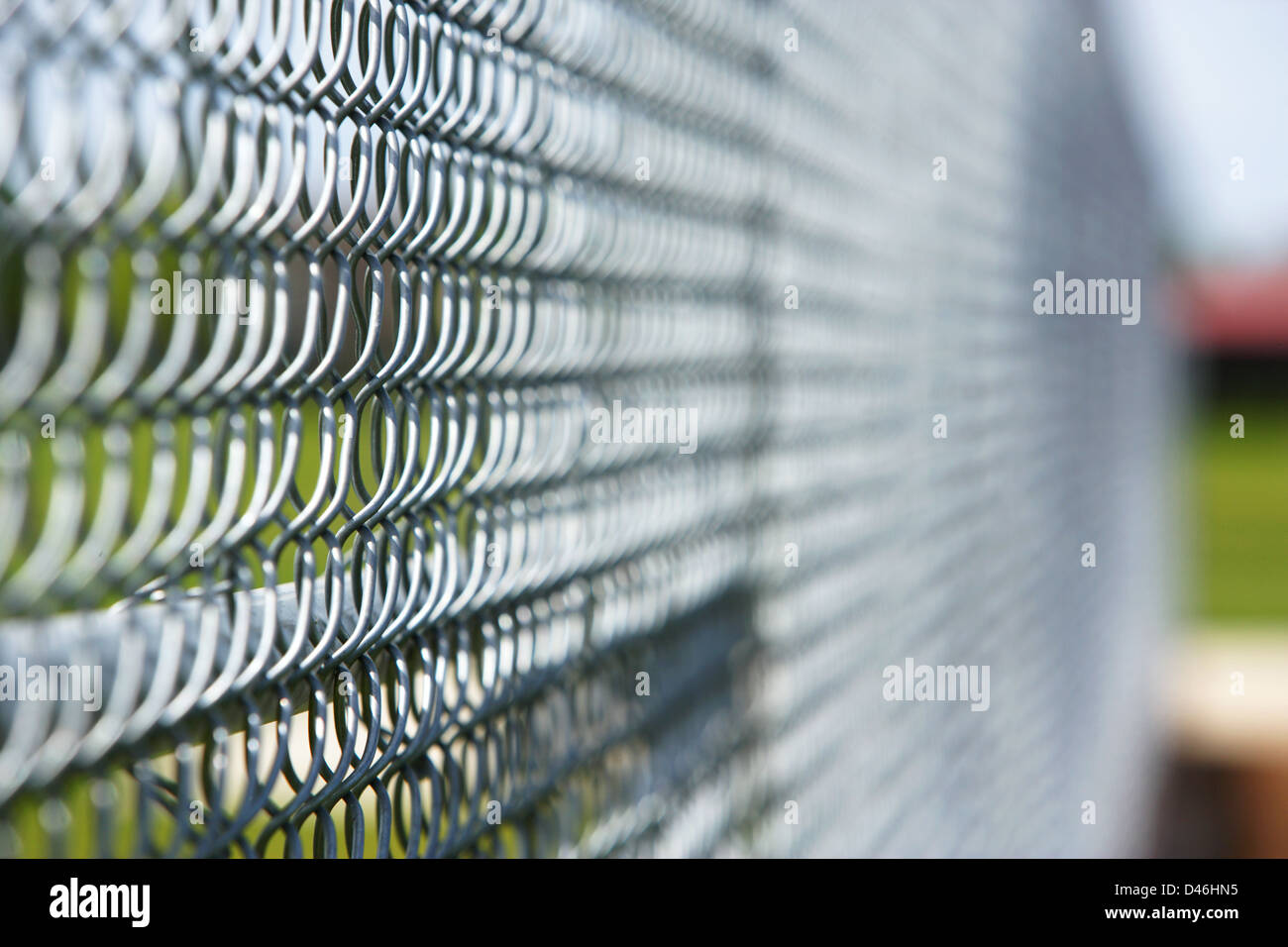 Chain link fence at a park Stock Photo - Alamy