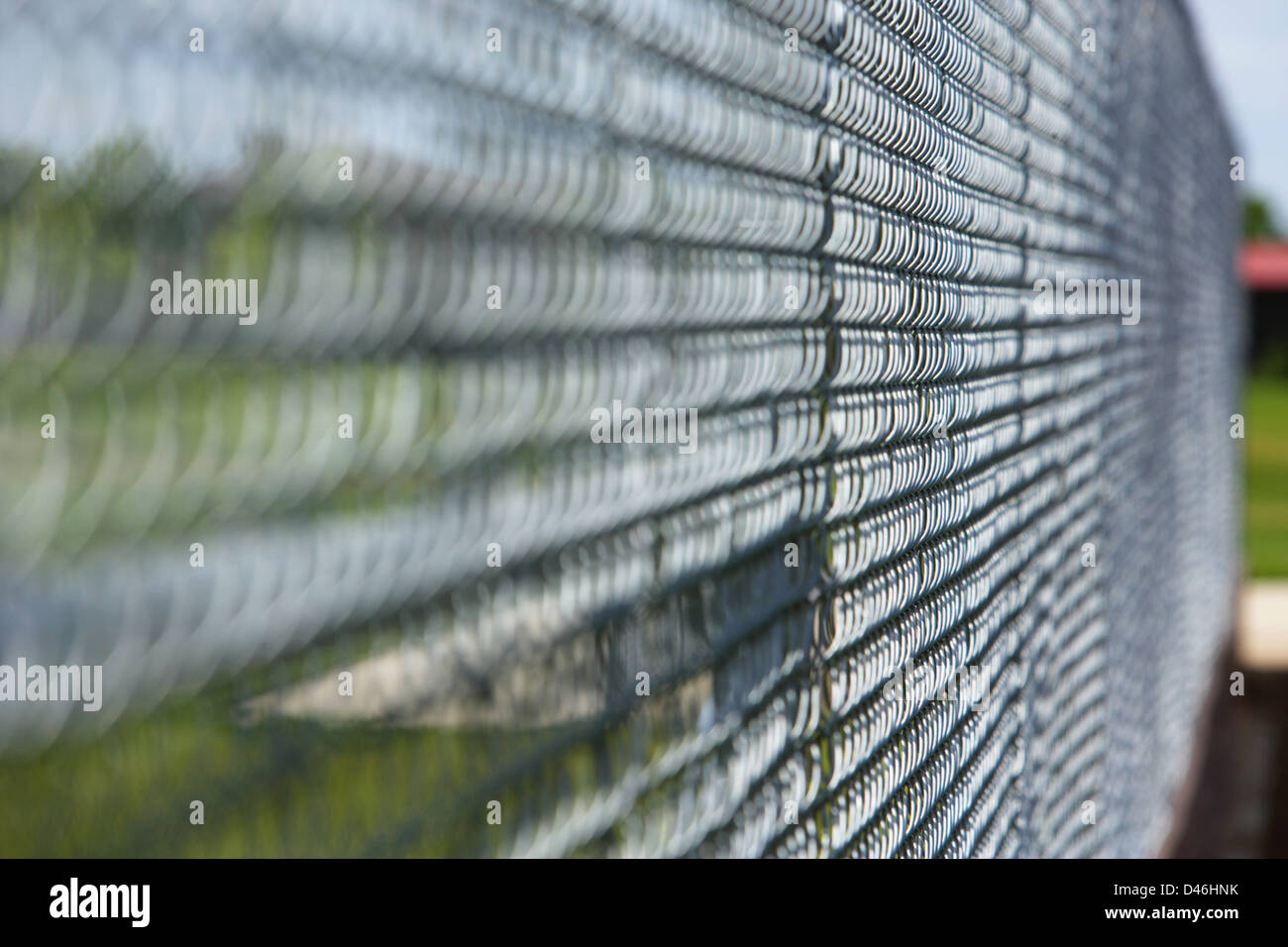 Chain link fence at a park Stock Photo - Alamy