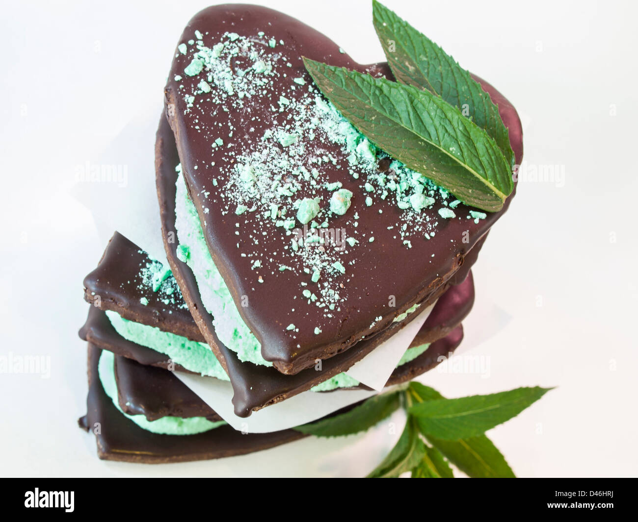 Chocolate cookies with mint filling on white background Stock Photo - Alamy
