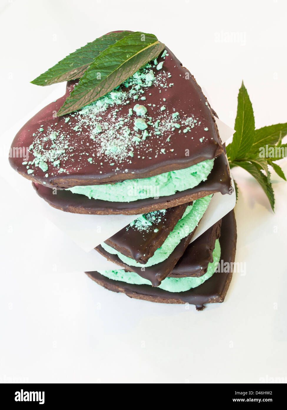 Chocolate cookies with mint filling on white background Stock Photo - Alamy