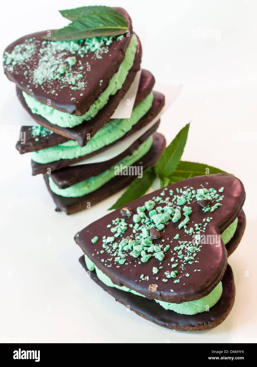 Chocolate cookies with mint filling on white background Stock Photo - Alamy