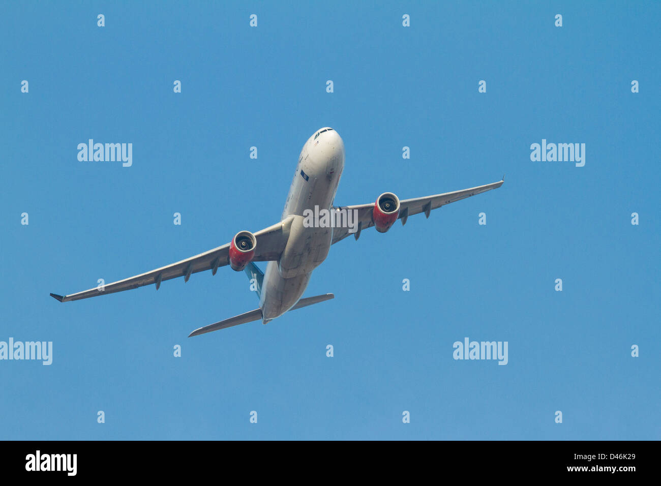 Airplane in the air making a turn Stock Photo - Alamy