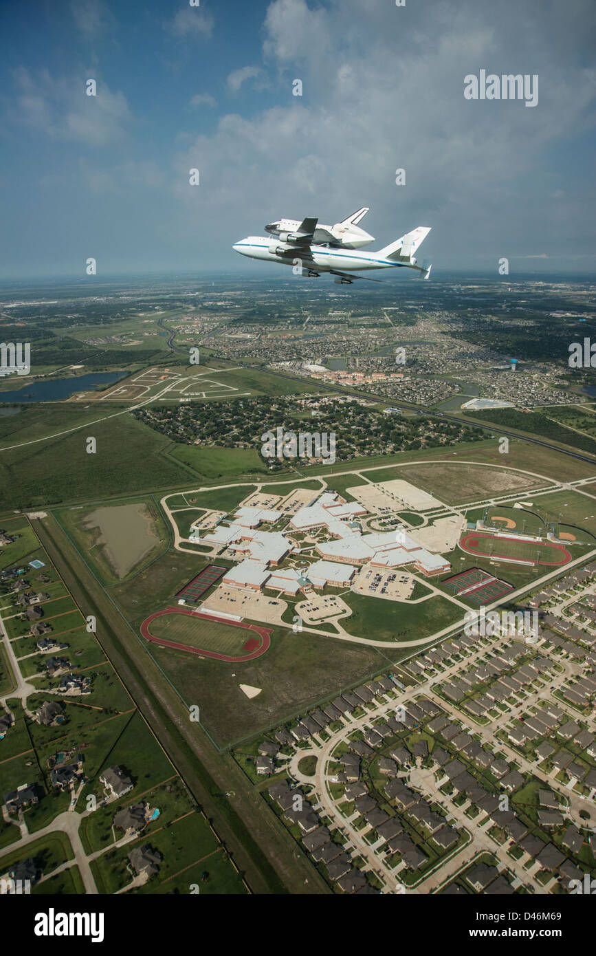The Space Shuttle Endeavour performs a flyover above Houston, Texas, as ...