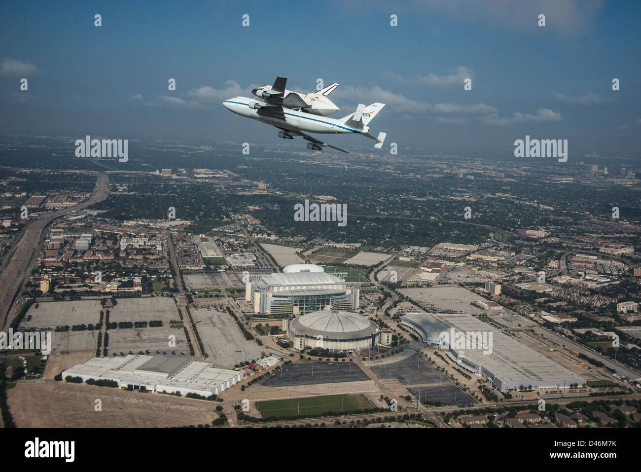 The Endeavour space shuttle flies over Houston, Texas, on its final ...