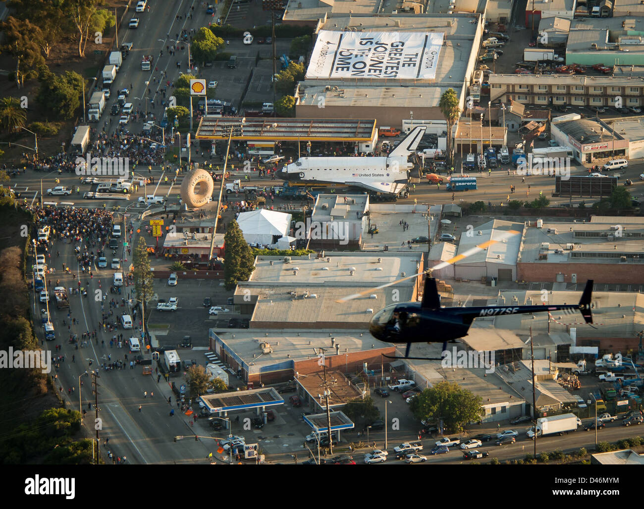Space Shuttle Endeavour is transported by helicopter through Los ...