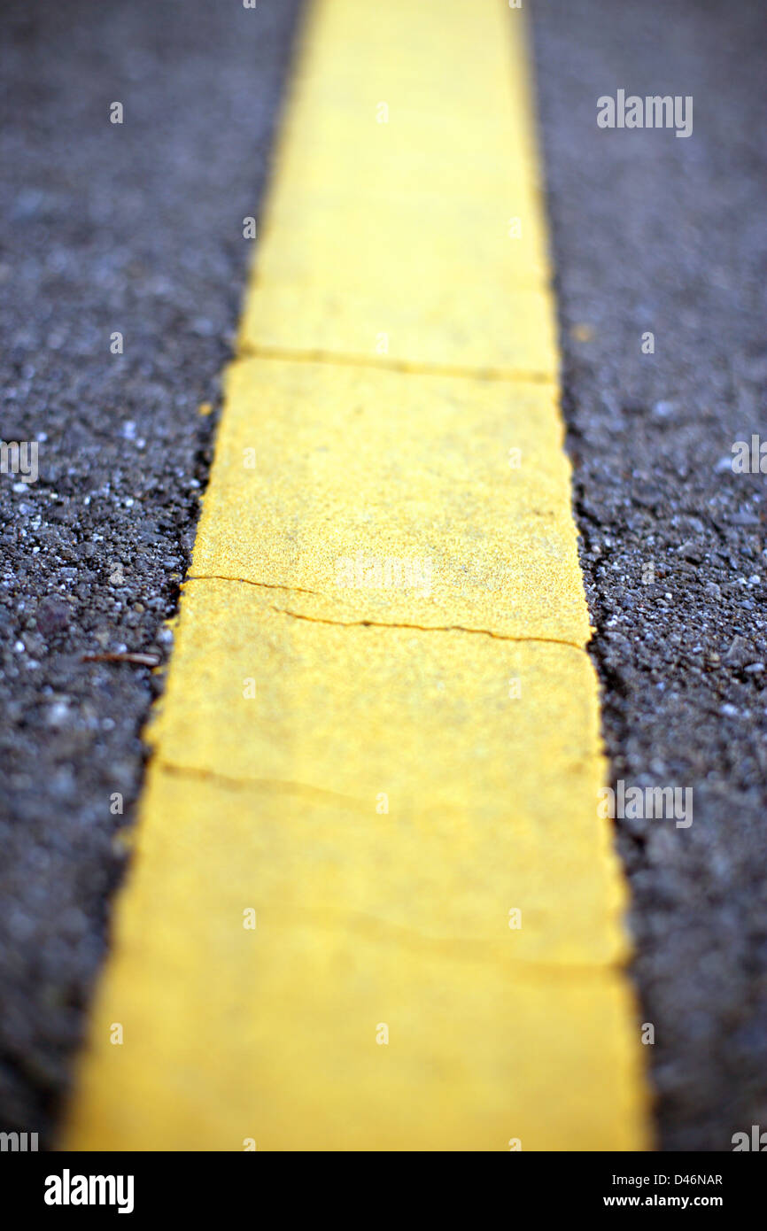 A yellow line in the middle of the road Stock Photo - Alamy