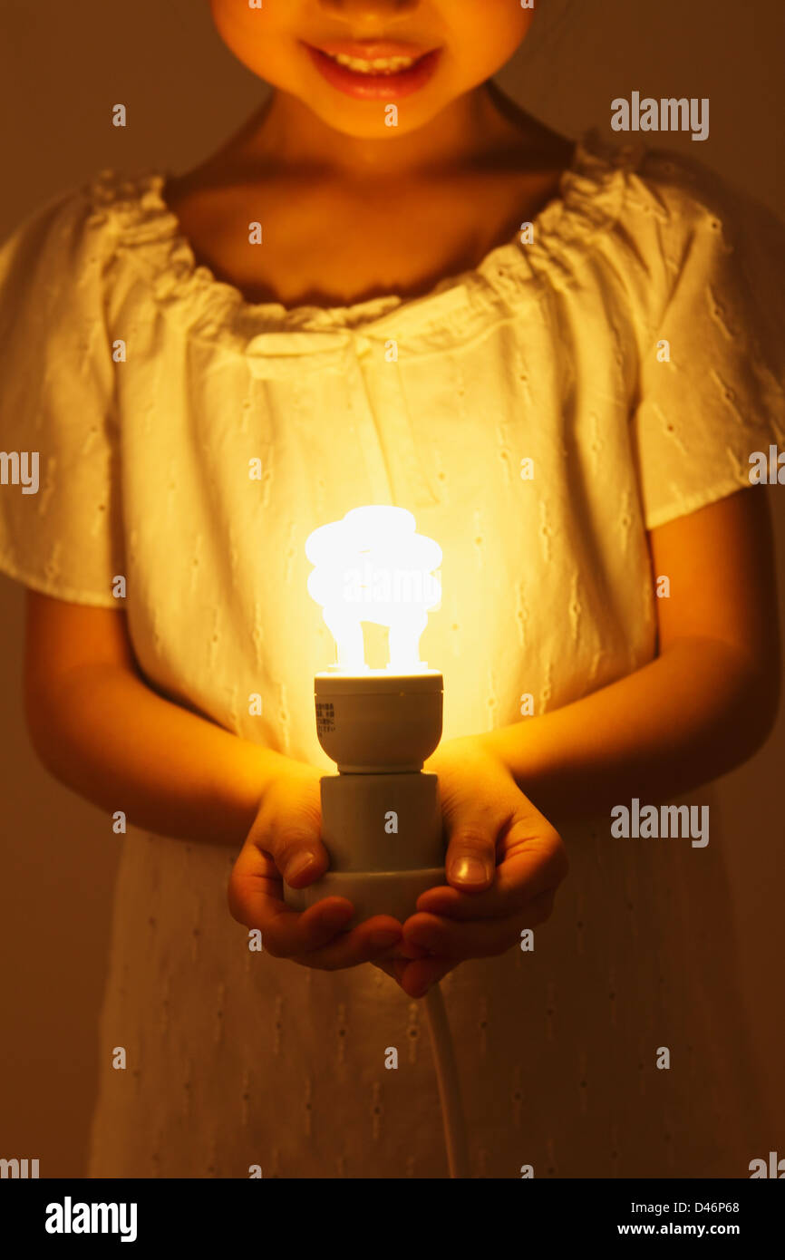 Girl Holding a Light Stock Photo - Alamy