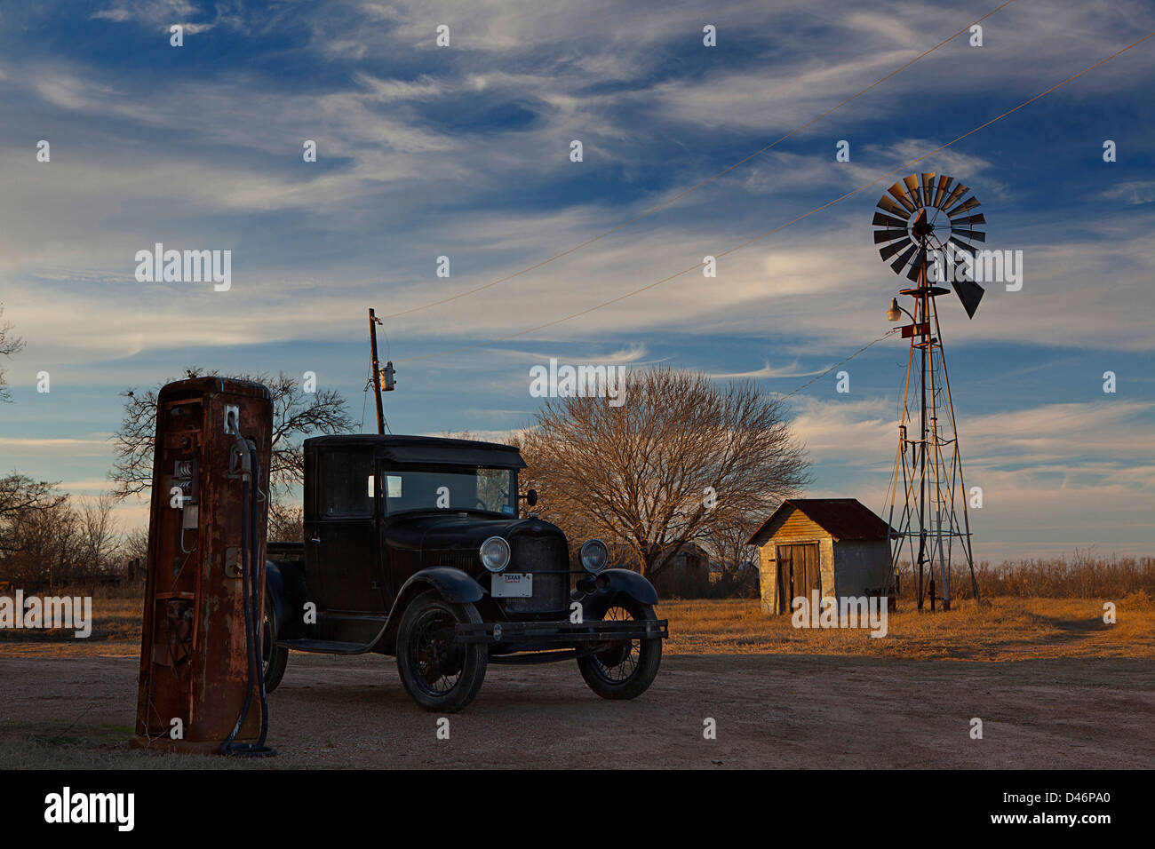 Old Model T Farm Truck and Windmill on a farm in Texas, USA Stock Photo ...