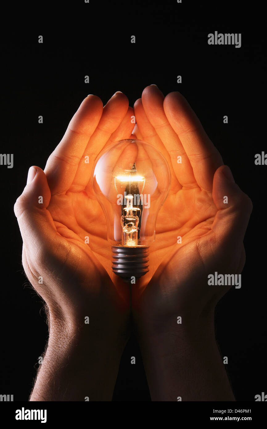 Five hands and light bulb hi-res stock photography and images - Alamy