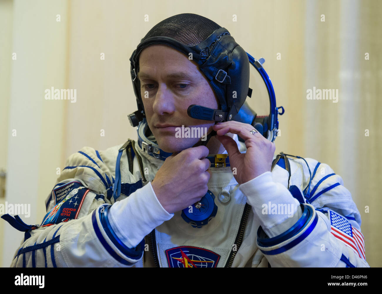 Expedition 34 crew members, including astronaut Tom Marshburn, prepare ...