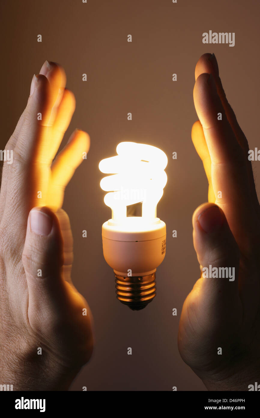 Five hands and light bulb hi-res stock photography and images - Alamy