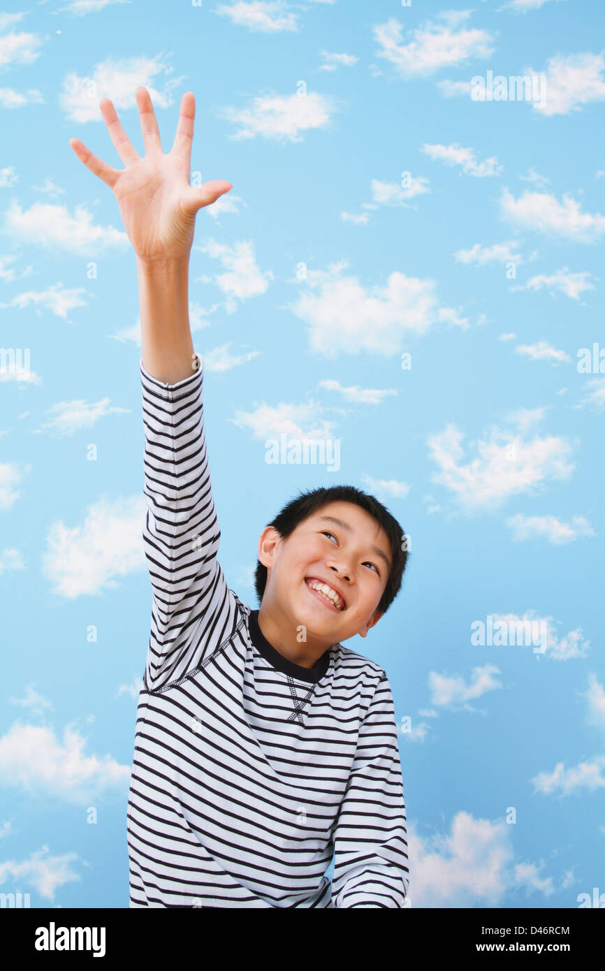 Boy Raising a Hand Stock Photo - Alamy