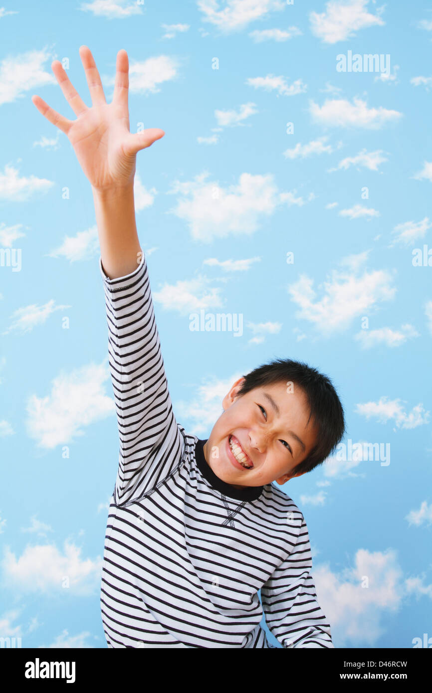 Boy Raising a Hand Stock Photo - Alamy