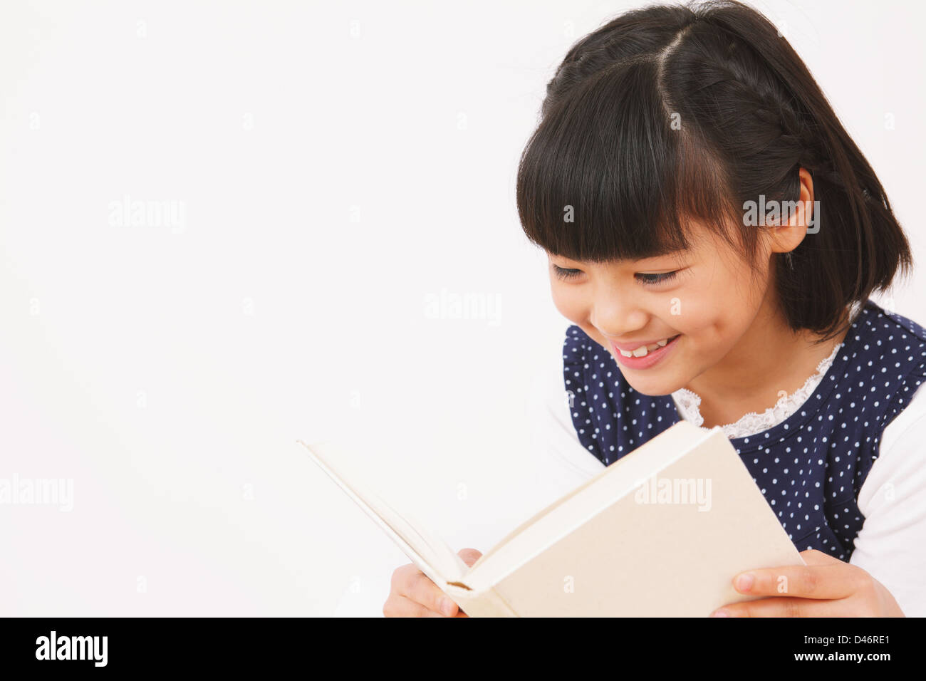 Girl Reading a Book Stock Photo - Alamy
