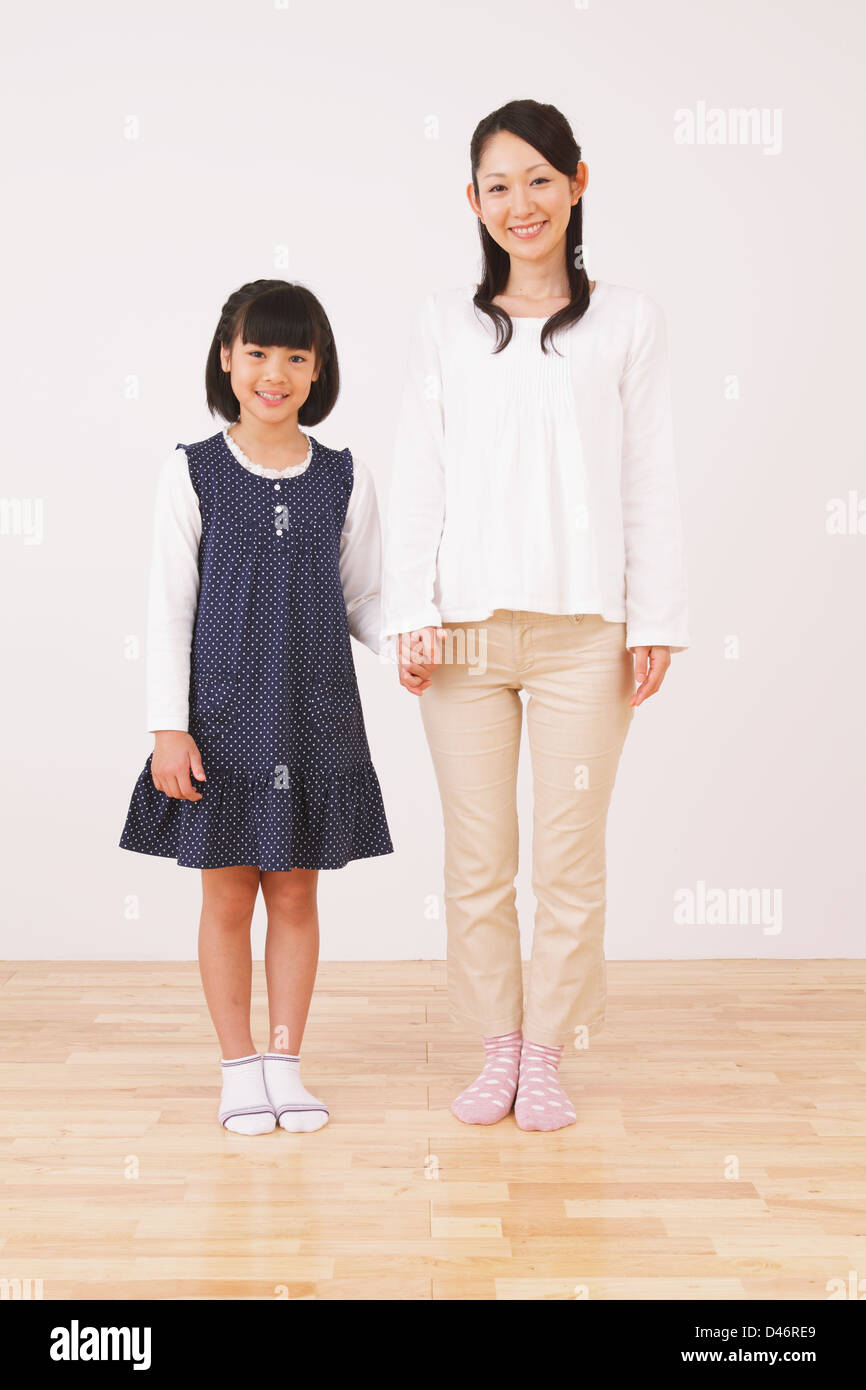 Mother And Daughter Standing Stock Photo - Alamy