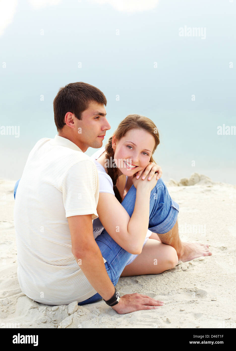 Peaceful couple enjoying summer vacation on sandy shore Stock Photo - Alamy