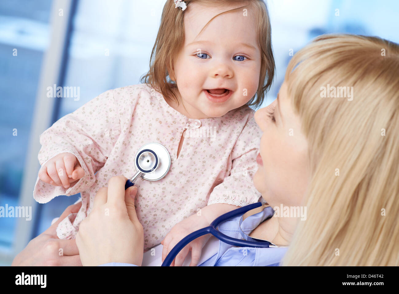 Cute baby being examined by female doctor in hospital Stock Photo - Alamy