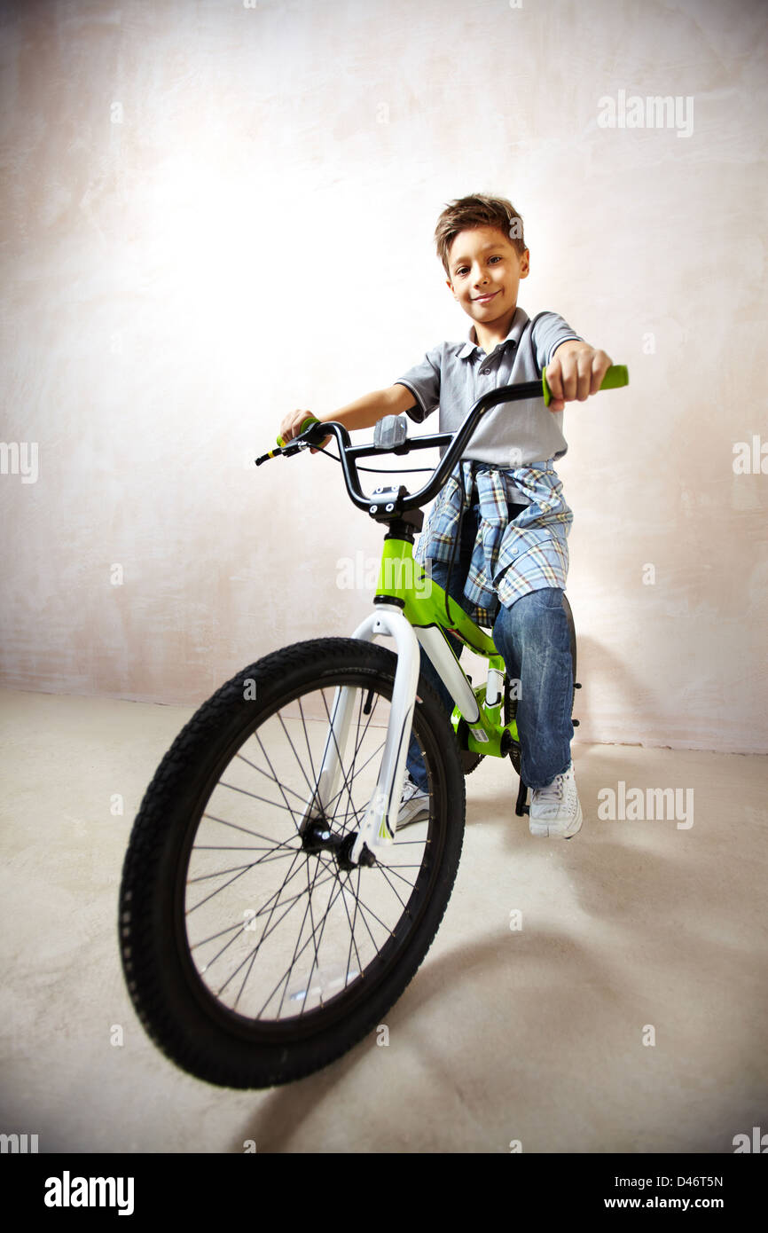 Portrait of happy boy on bicycle looking at camera Stock Photo - Alamy