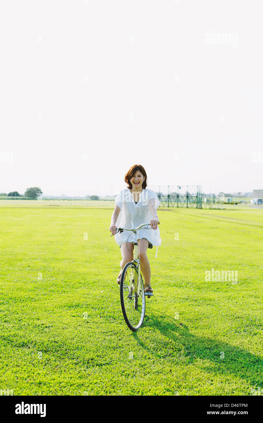 Woman Riding a Bicycle Stock Photo - Alamy
