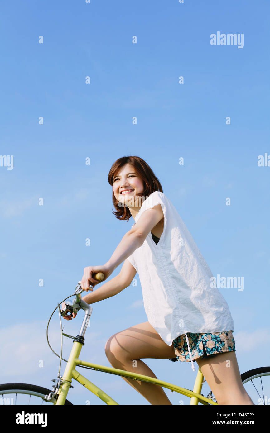 Woman Riding a Bicycle Stock Photo - Alamy