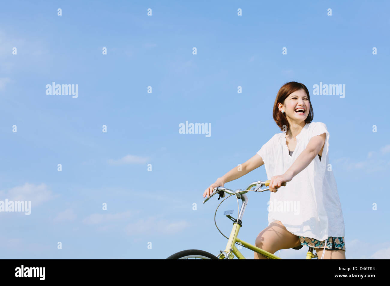 Woman Riding a Bicycle Stock Photo - Alamy