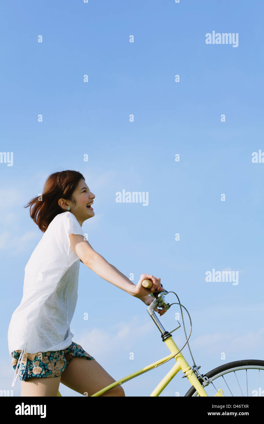 Woman Riding a Bicycle Stock Photo - Alamy