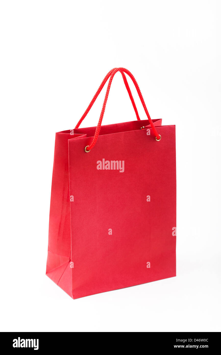 Red paper bag closeup isolated on white background Stock Photo - Alamy