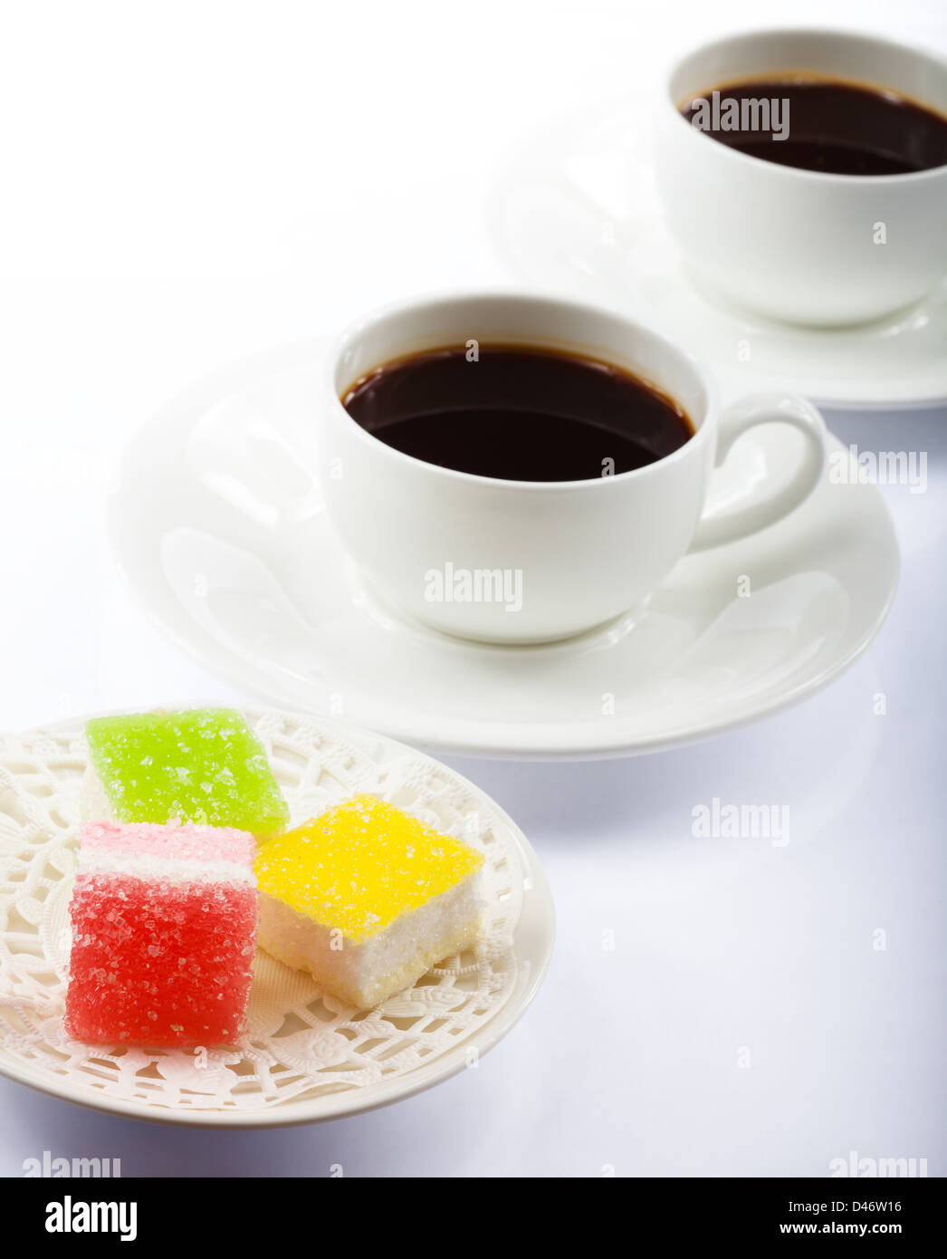 Cup of coffee and sweets on white closeup Stock Photo - Alamy